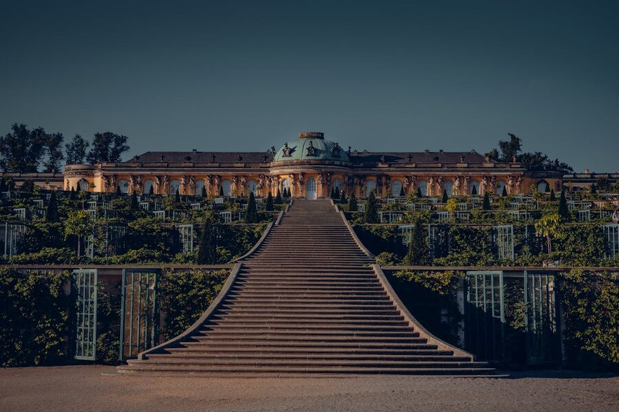 Manicured gardens and palace architecture at Sanssouci Park in Potsdam
