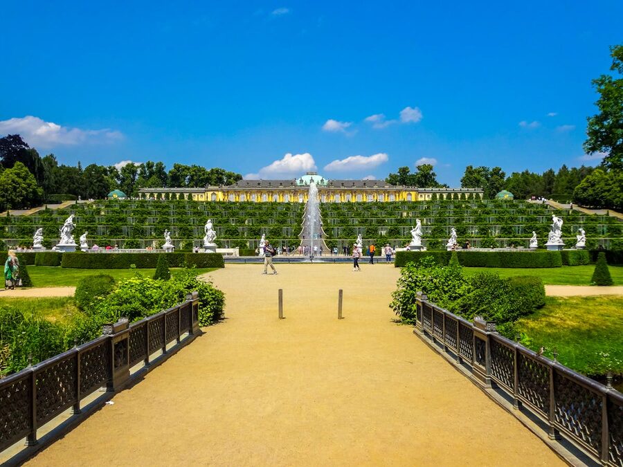 Sanssouci Palace with lush green gardens in summer