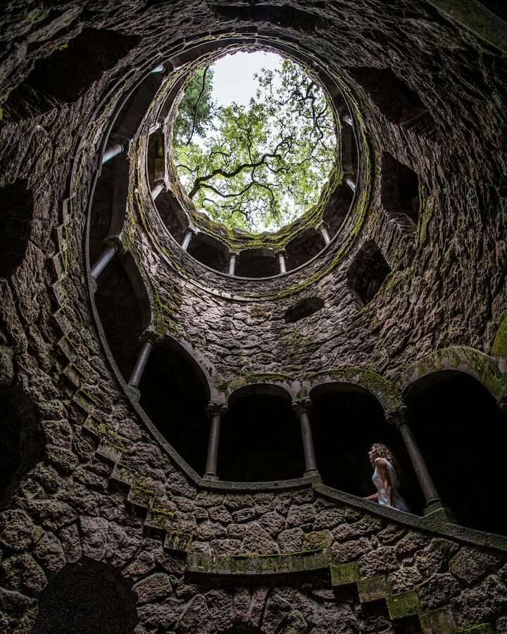 Spiral stone staircase inside the Initiation Well at Quinta da Regaleira Sintra