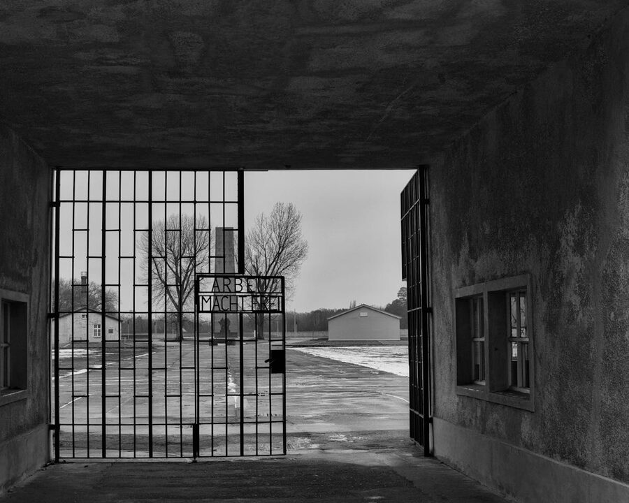 Black and white view of the entrance gate at Sachsenhausen Memorial in Oranienburg Germany