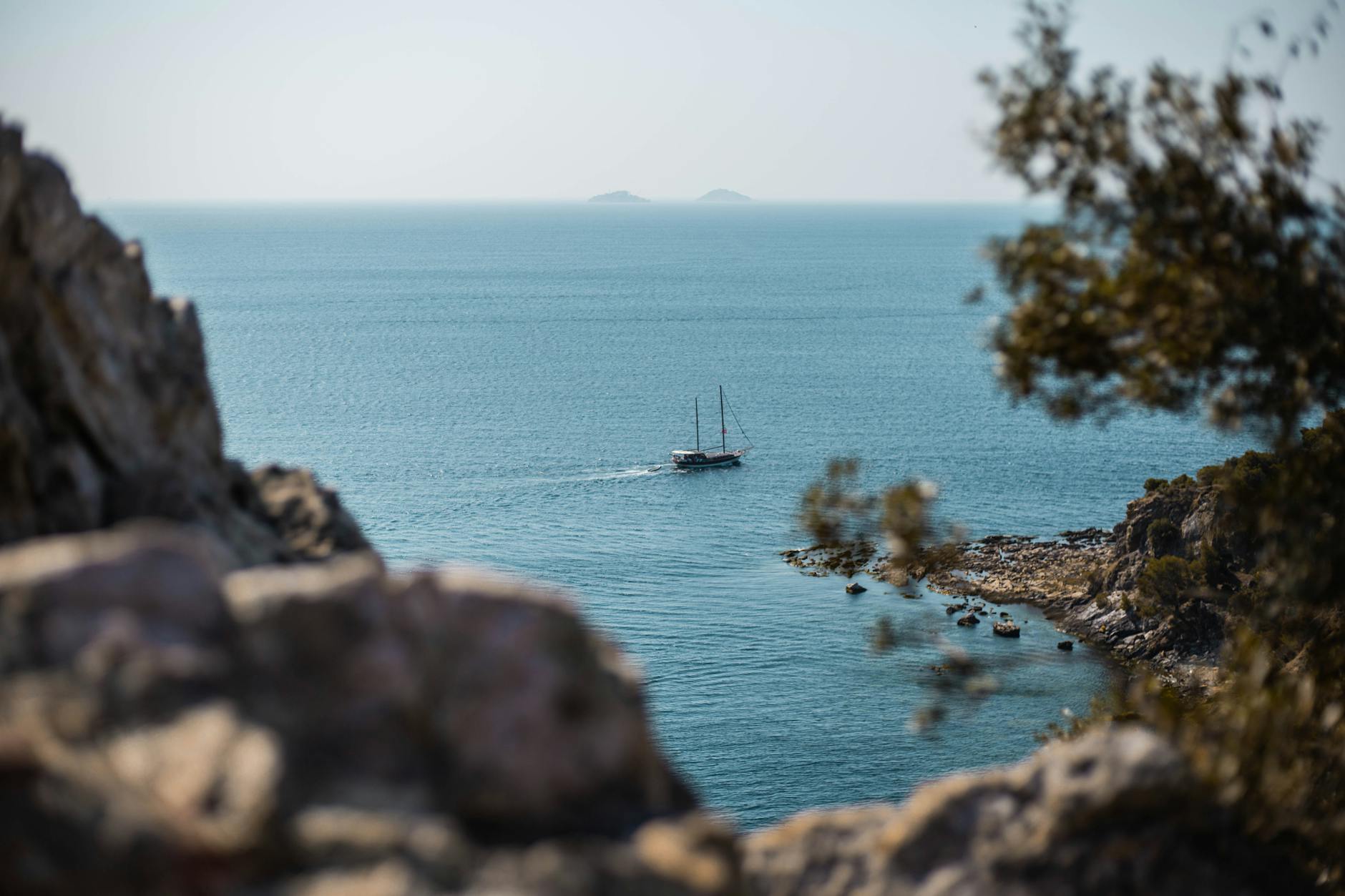 Sailing boat cruising through the Greek sea