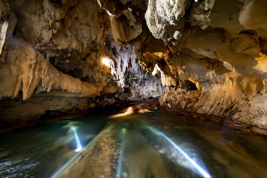 Underground cave with illuminated water