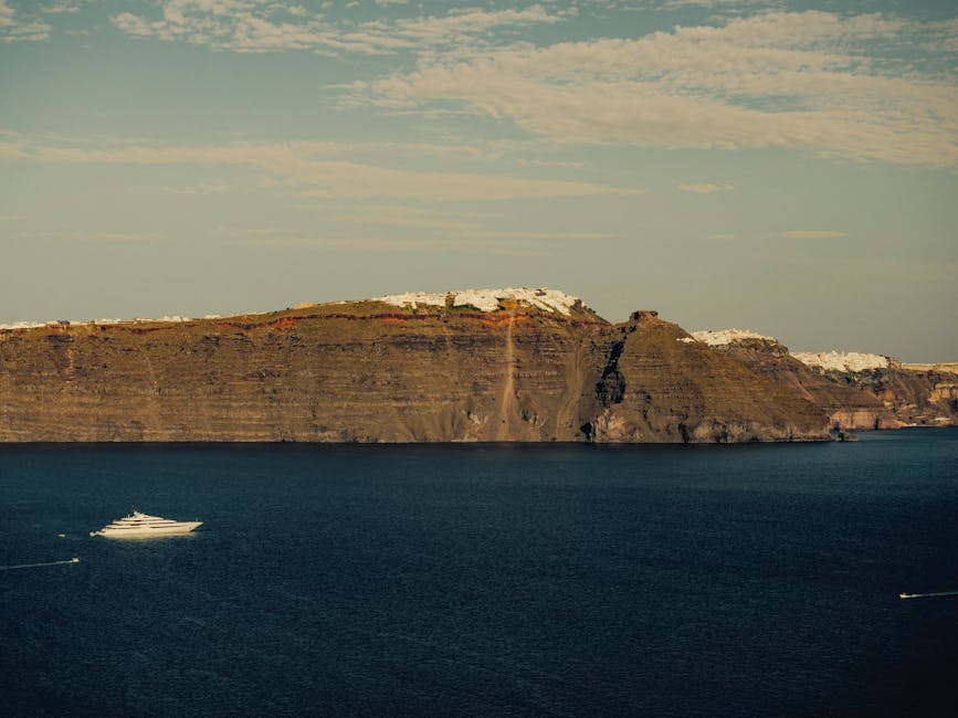 Santorini caldera wall seen from a boat on the water