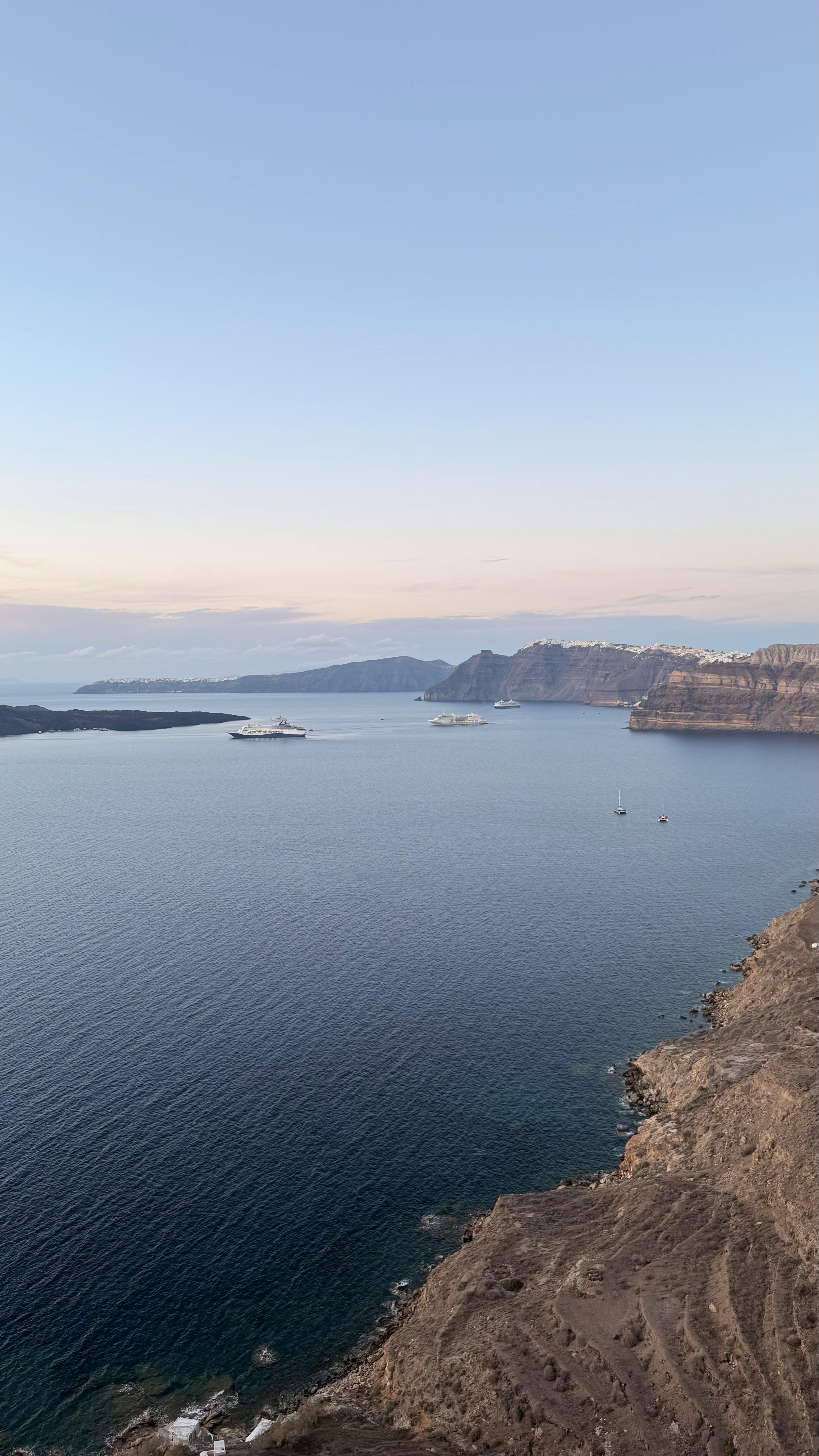 Santorini caldera at sunset seen from the water