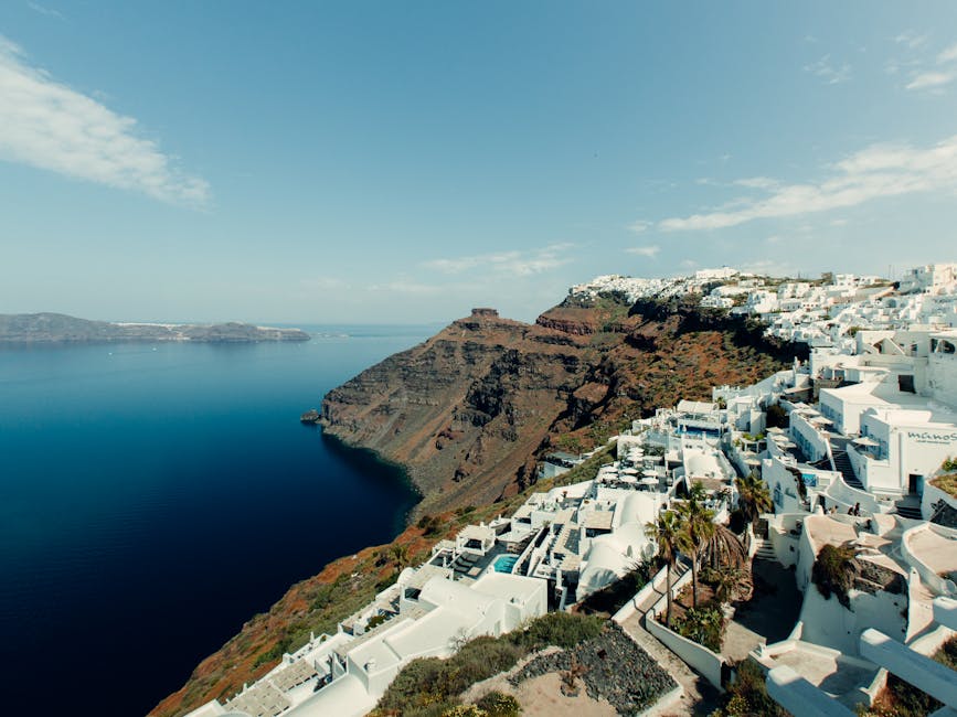 White houses of Oia cascading down the Santorini caldera