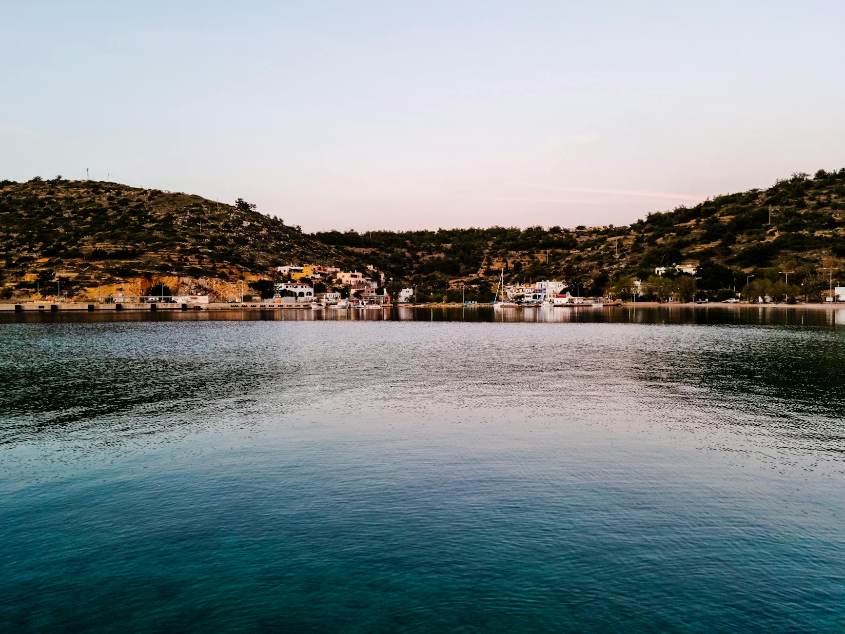 Saronic Greek waterfront with calm sea and hills