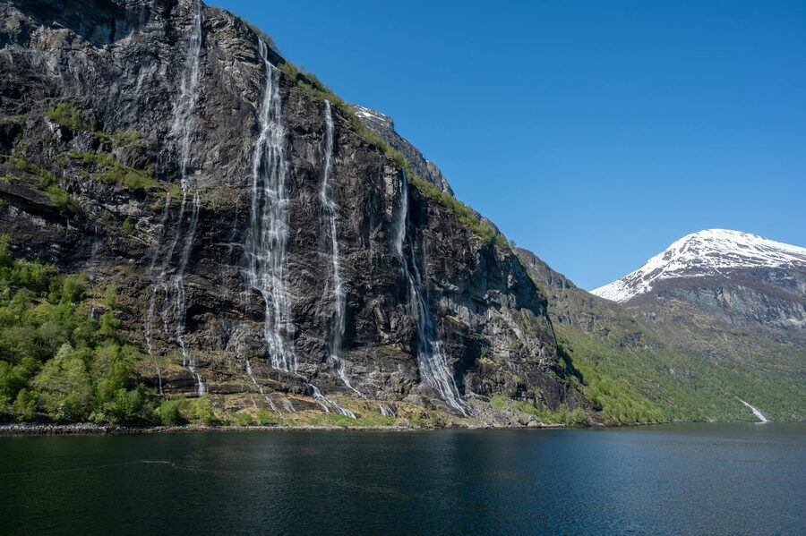Seven Sisters Waterfall cascading into Geirangerfjord in Norway