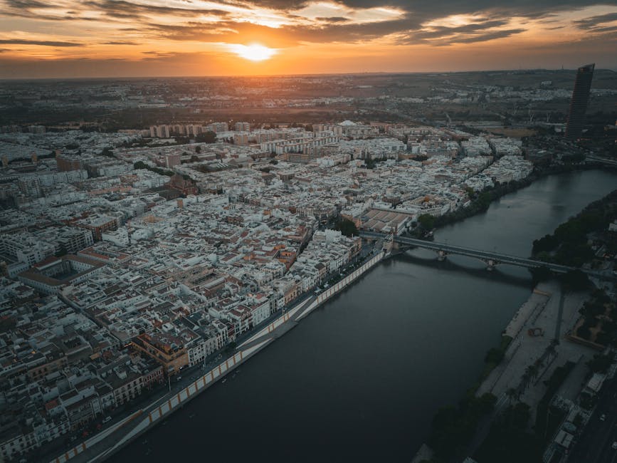 Aerial view of Seville at sunset showing the river