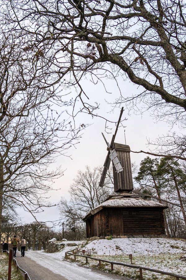 Traditional Swedish windmill in snow at Skansen museum