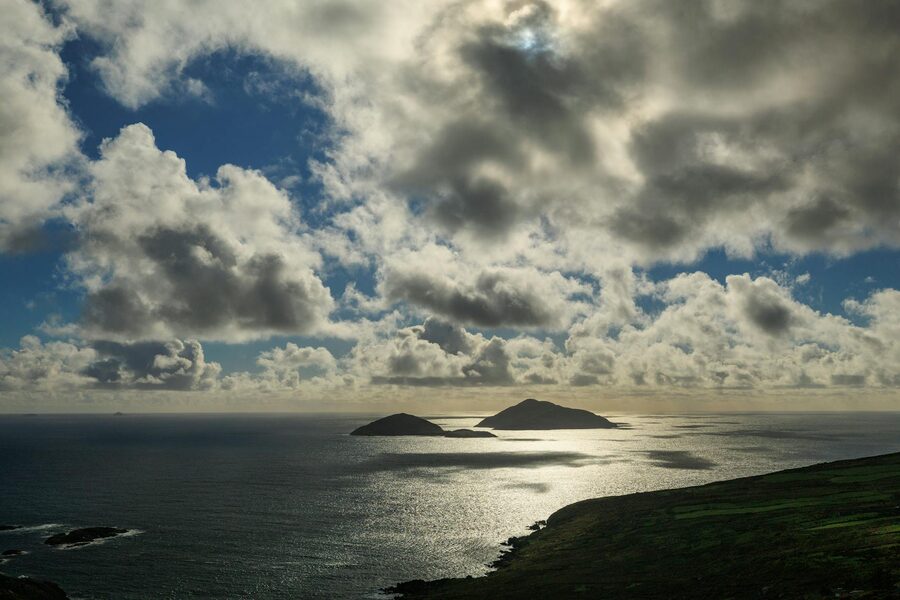 Dramatic clouds over Skellig Islands with shimmering sea