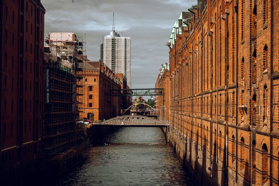 Red brick warehouses lining a canal in Hamburg's Speicherstadt district