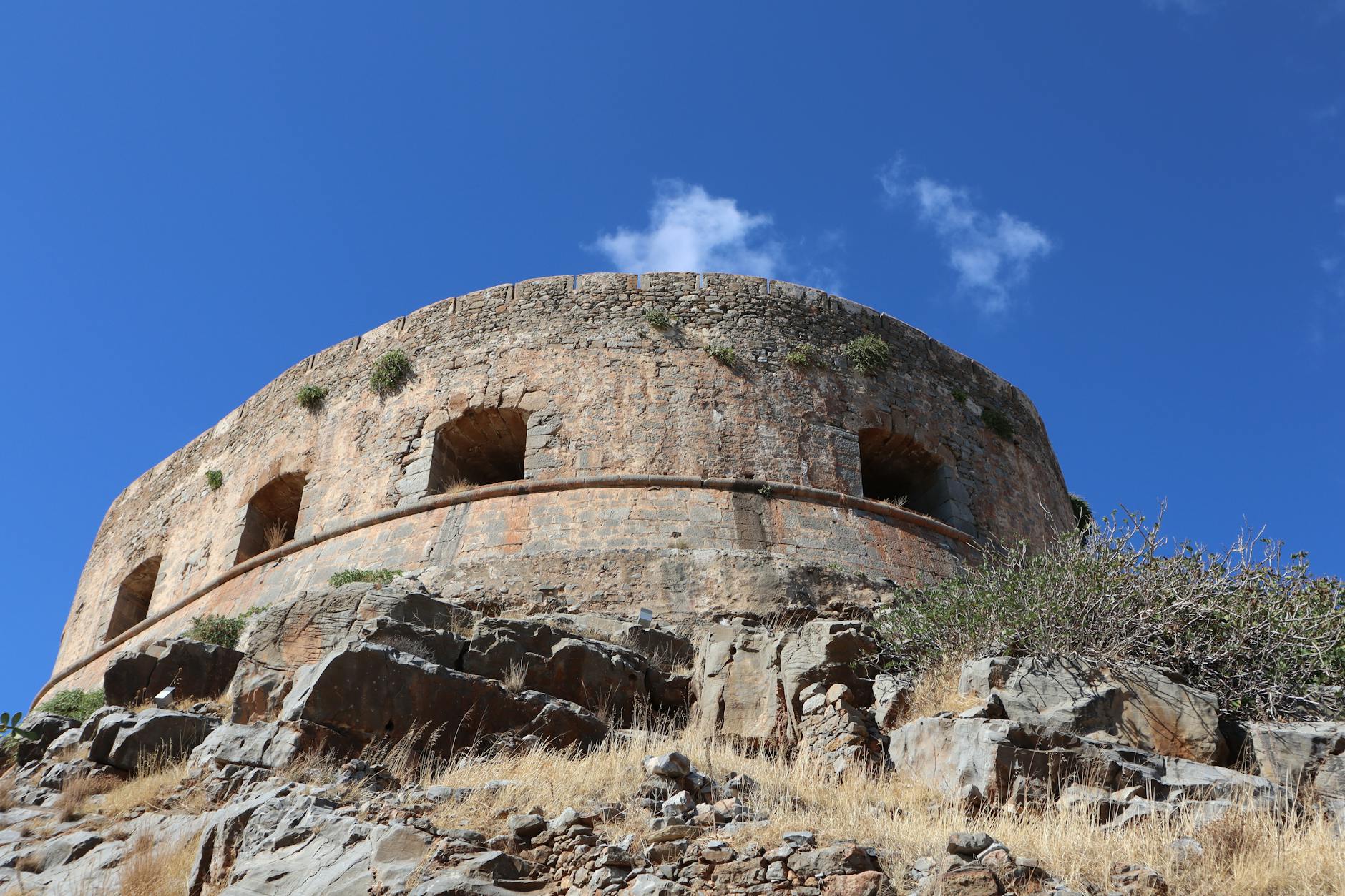 Ancient stone fortress walls of Spinalonga island in Crete