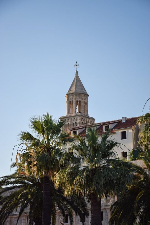 Tower of Cathedral near palm trees in Split Croatia