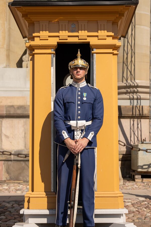 Swedish royal guard standing at attention outside Stockholm Palace
