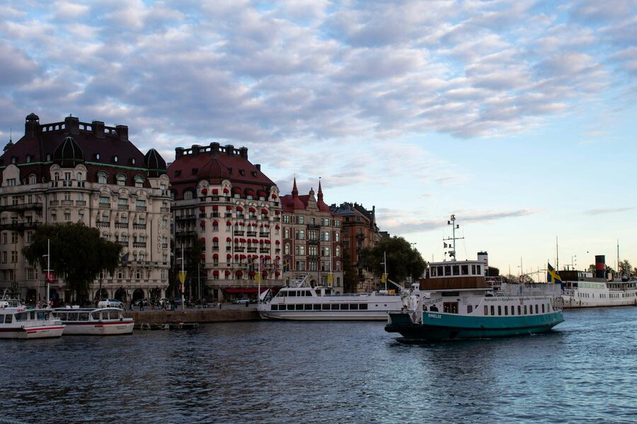 Historic boats and buildings along Stockholm waterfront