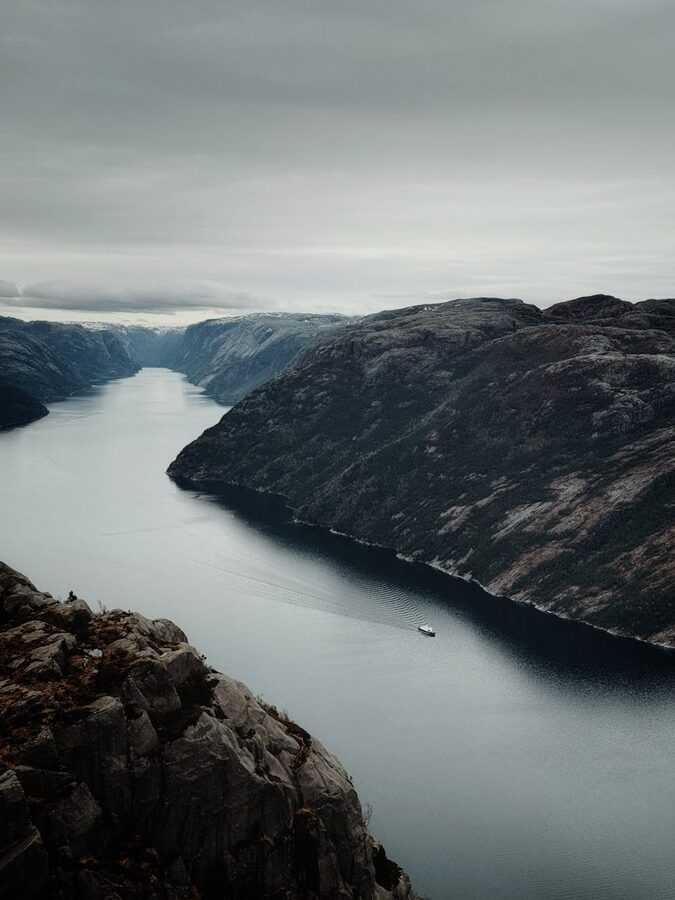 Aerial view of a Norwegian fjord stretching between cliff walls