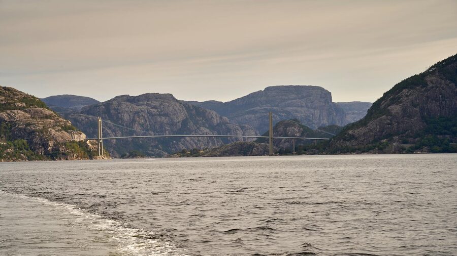 Lysefjord Bridge spanning calm waters with mountains on either side
