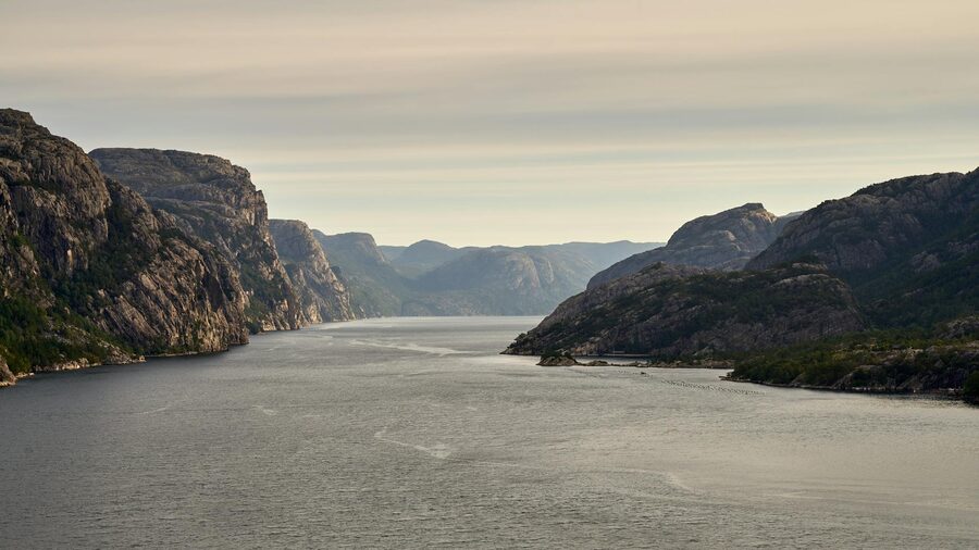 Lysefjord with calm green waters and steep mountain walls