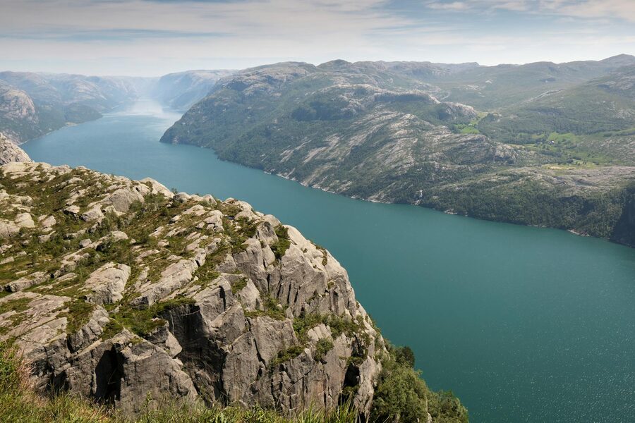 Lysefjord with clear waters and rocky terrain on both sides