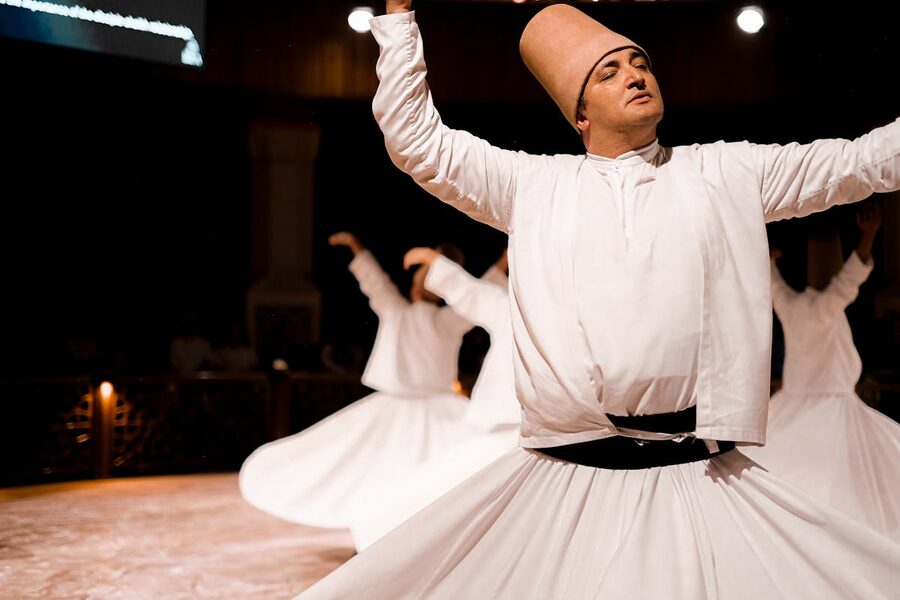 Sufi dervish spinning in traditional attire