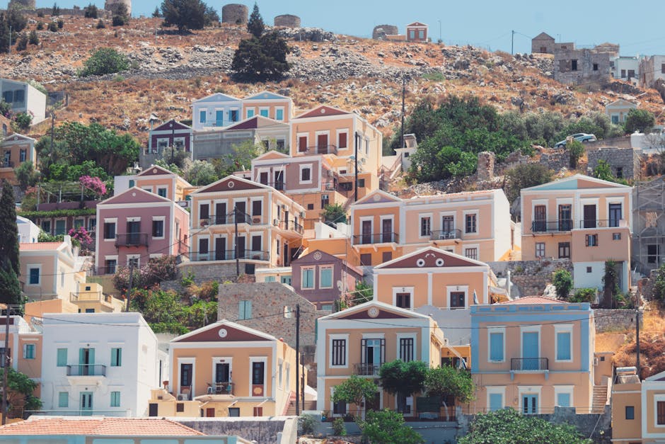 Small fishing boats floating on clear turquoise water near Symi