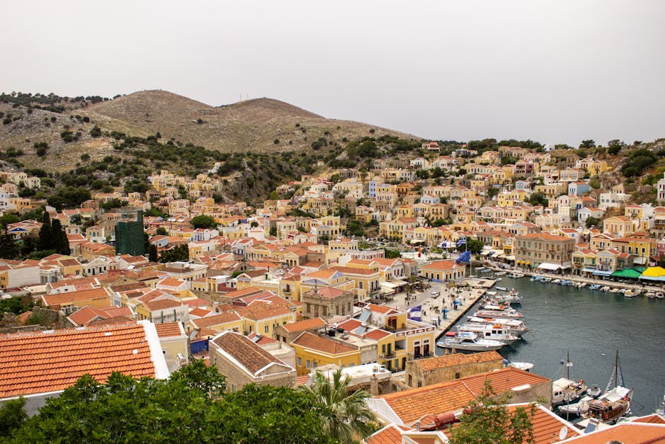 Colorful buildings rising up the hillside of Symi town