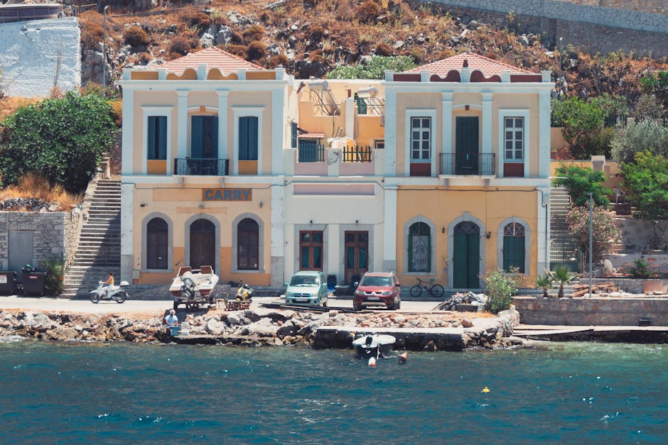 View across Gialos harbor with the town rising above the water