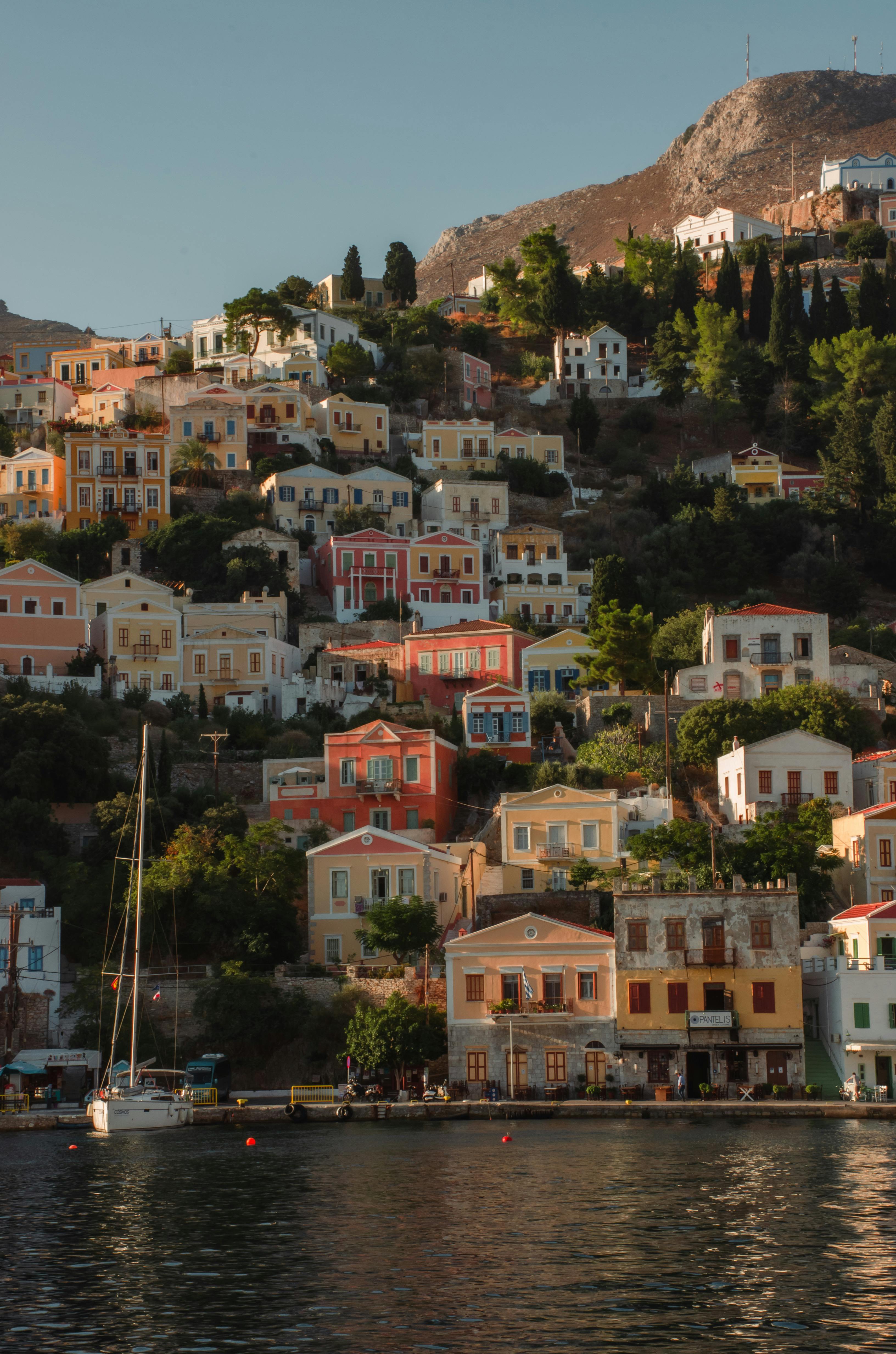Panoramic view of Symi hillside houses and the Aegean sea