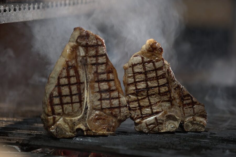 T-bone steaks on barbecue