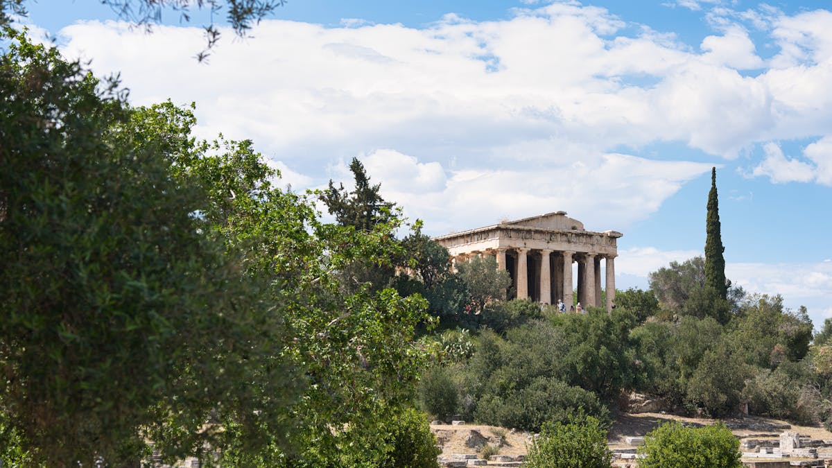 Temple of Hephaestus in Athens Ancient Agora surrounded by greenery