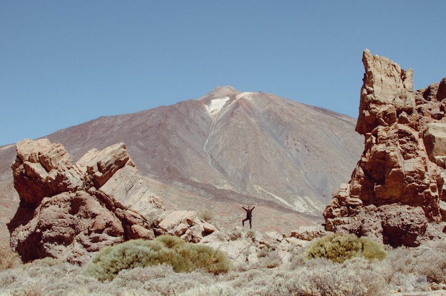 Visitor among volcanic rocks at Mount Teide