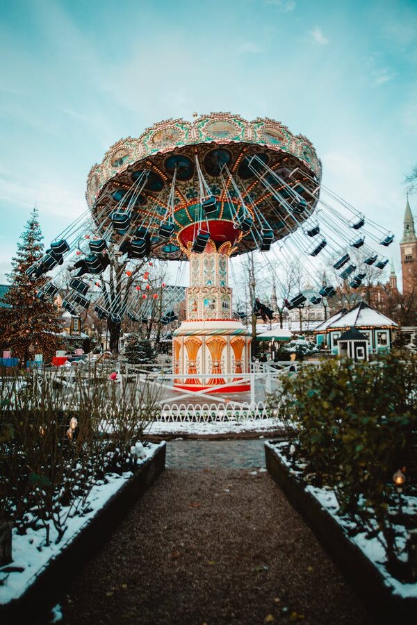Festive carousel in a snowy winter park setting