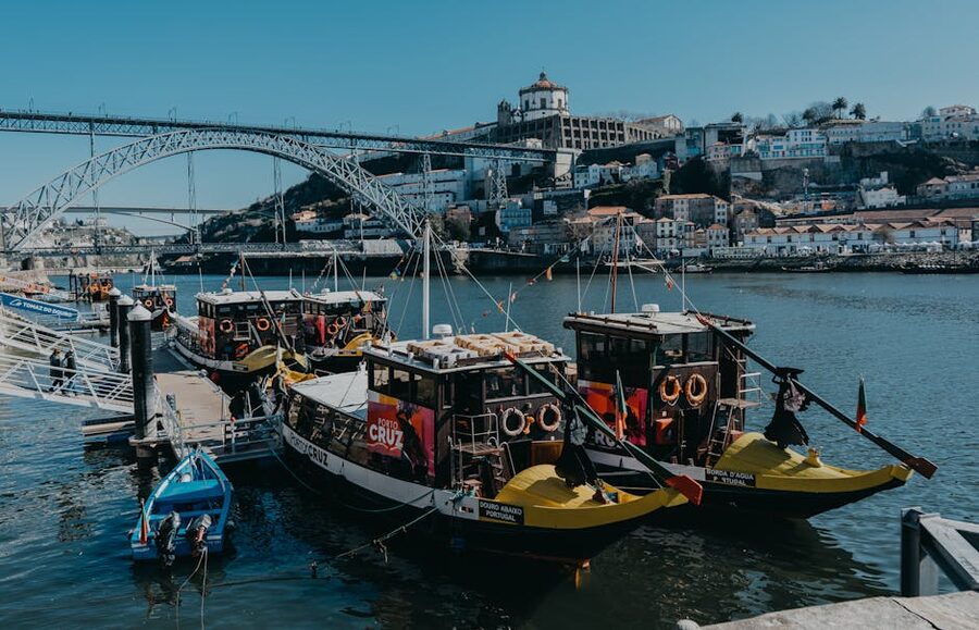 Boats on Douro River Dom Luis bridge Porto