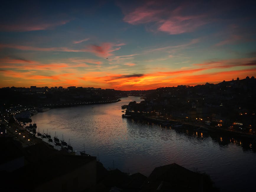 Sunset over Douro River Porto with cruise boats