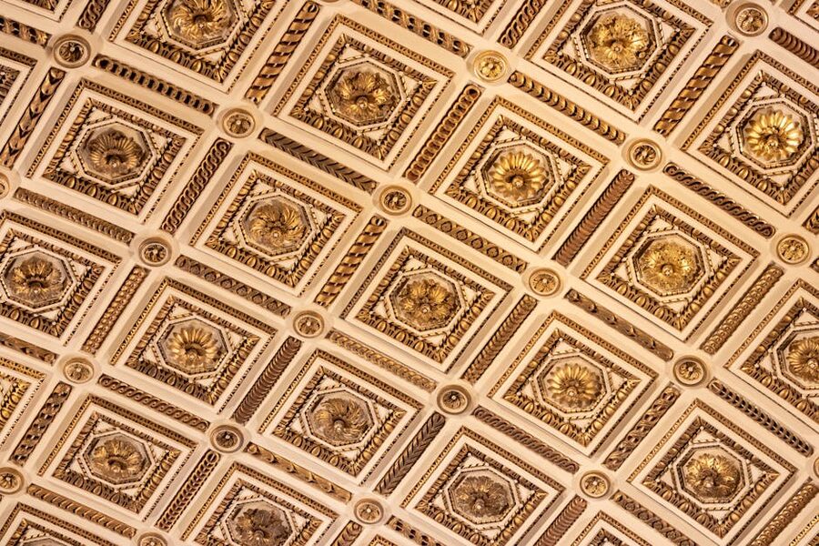 Ornate gold and white ceiling in the Uffizi Gallery