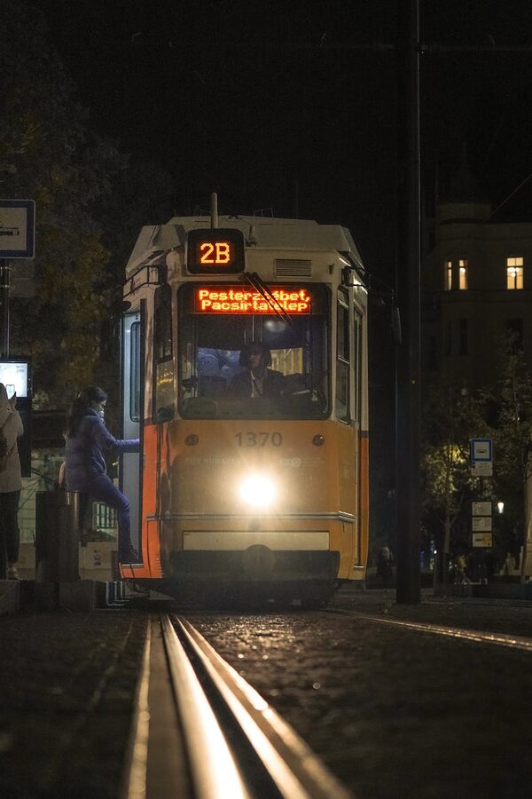 Tram glowing at night on Budapest streets
