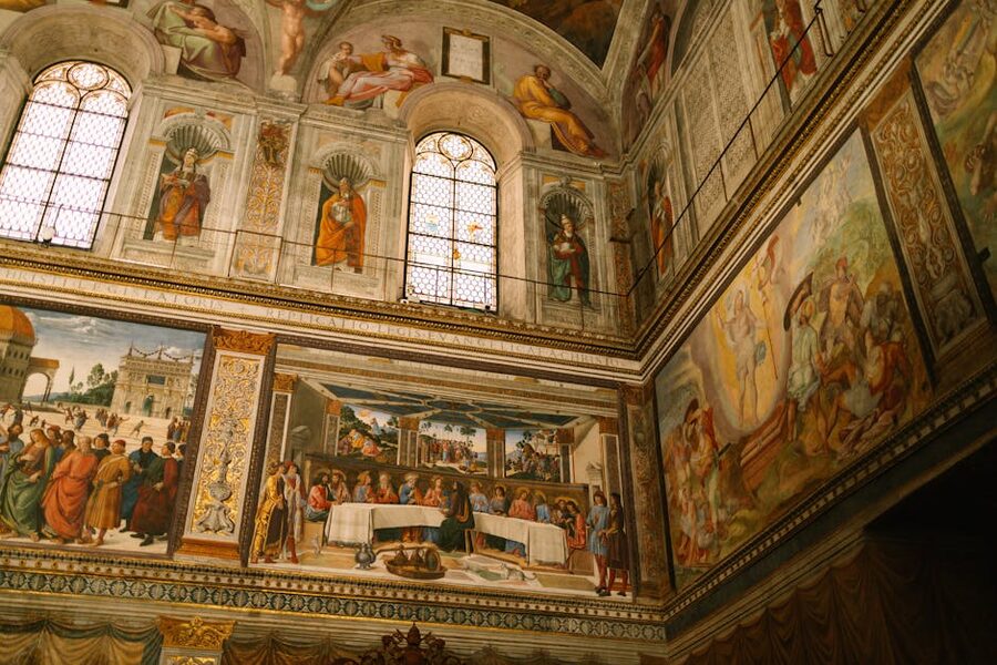 Detailed frescoes on the walls of the Sistine Chapel