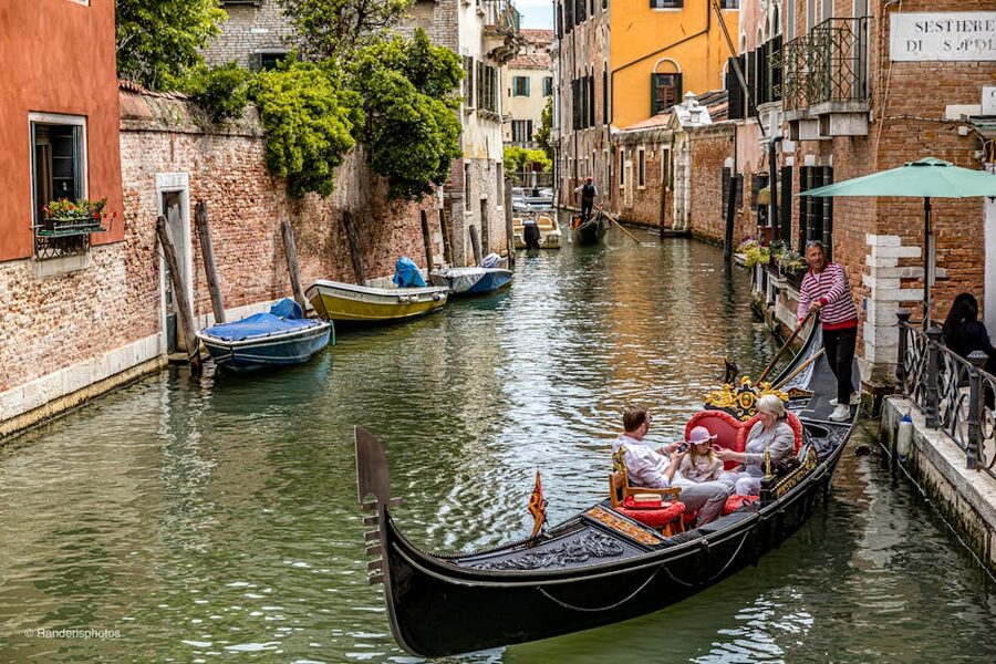 Tourists on a gondola ride in Venice