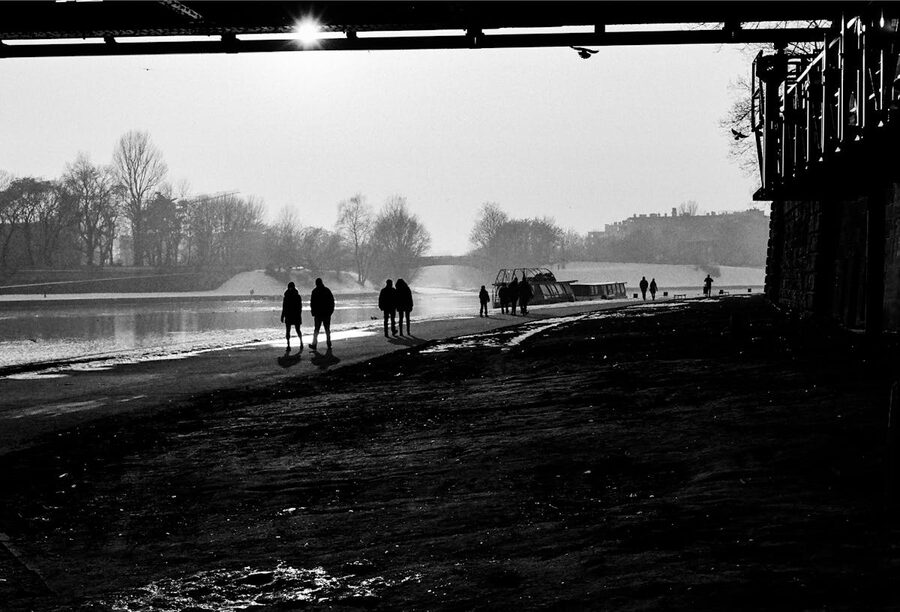 River scene with city buildings in background