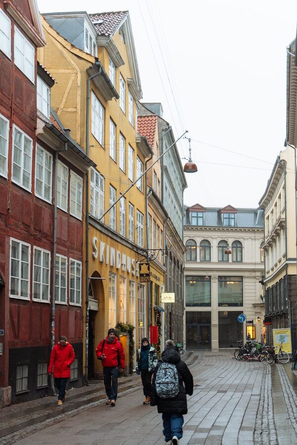 Copenhagen pedestrian street in winter with colourful buildings and warm lighting