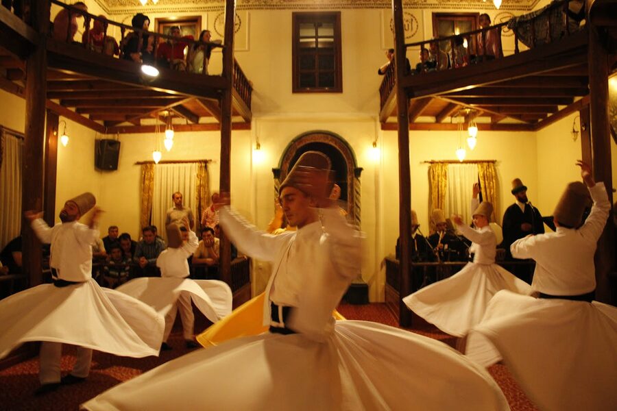 Dervishes performing with audience watching