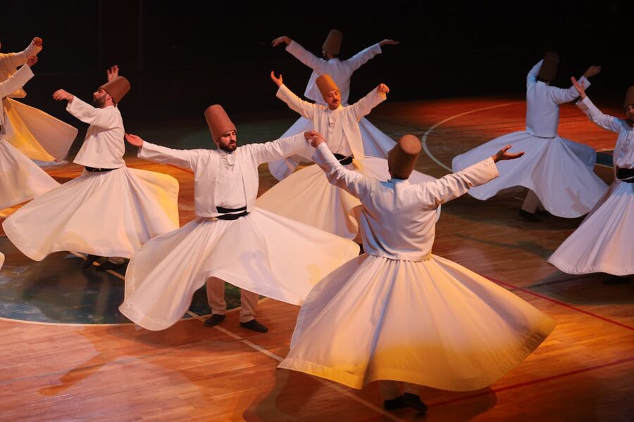 Group of whirling dervishes performing Sufi dance
