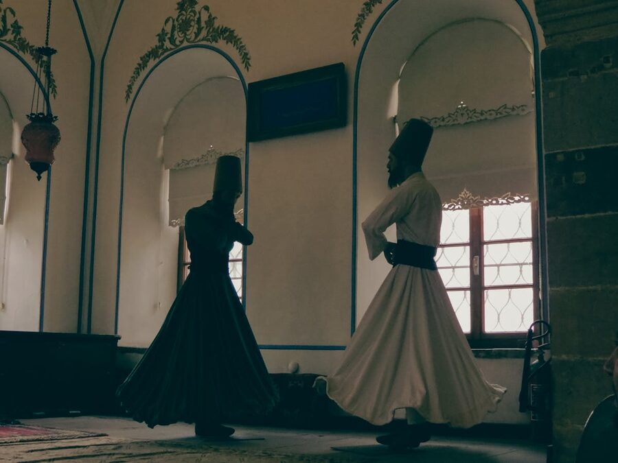 Two whirling dervishes performing in Konya