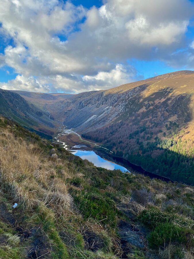 Lake surrounded by mountains in Wicklow Ireland with valley view