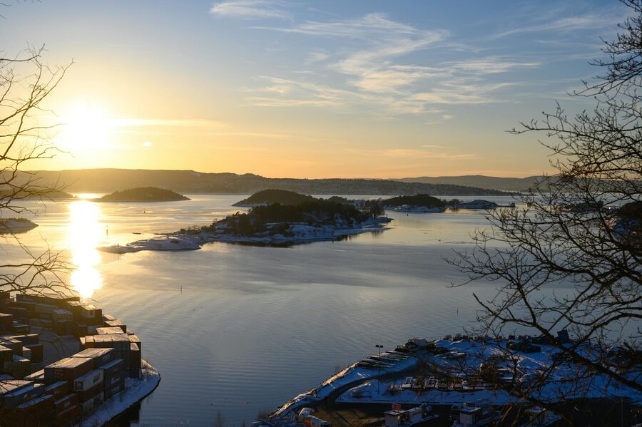 Winter sunset over Oslo fjord with islands and calm sea