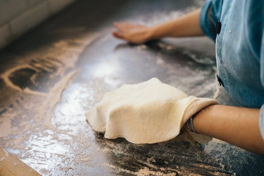 Worker kneading dough