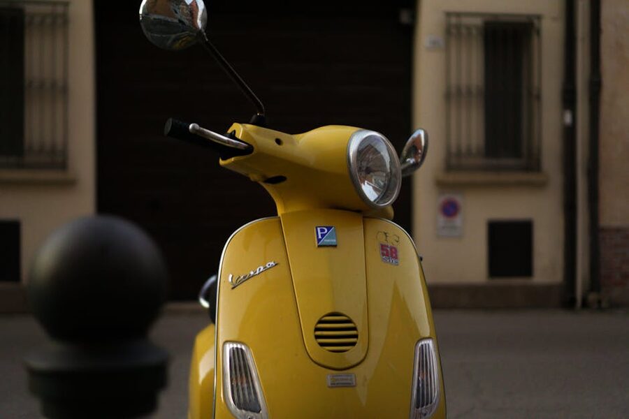 Yellow Vespa on quiet Italian street