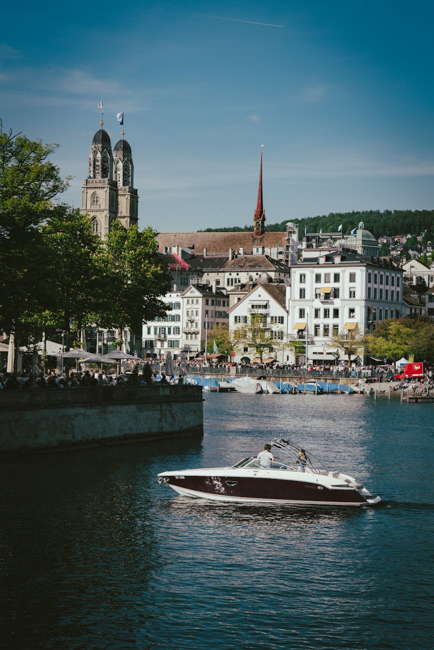 Boat on Lake Zurich with Fraumünster church in background
