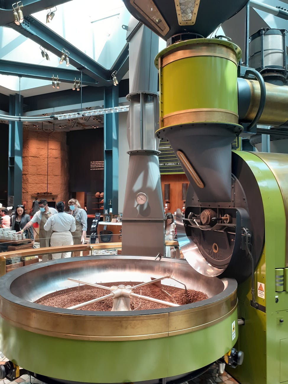 Chocolate factory interior with machinery and visitors