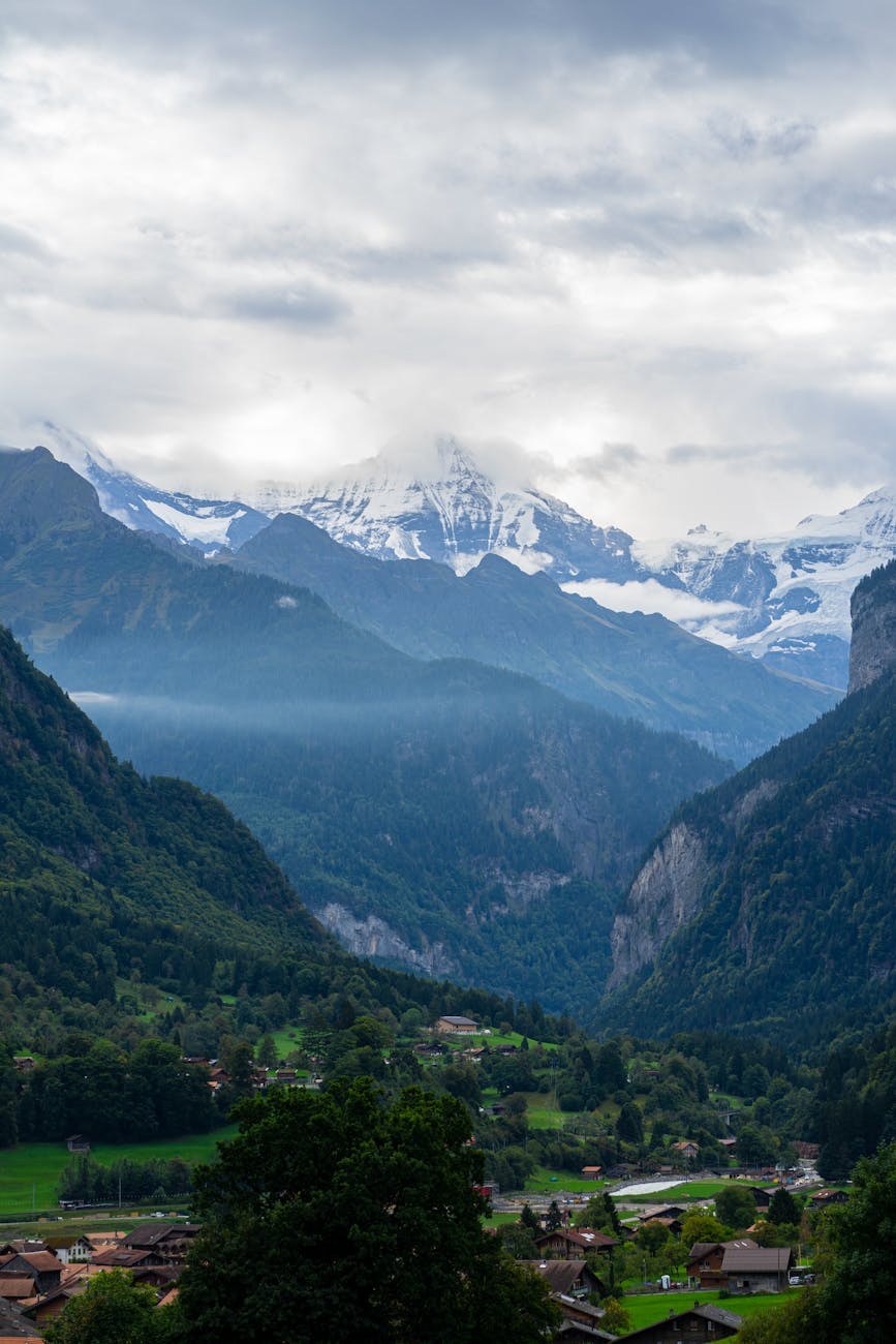 Swiss Alps village with snow-capped peaks